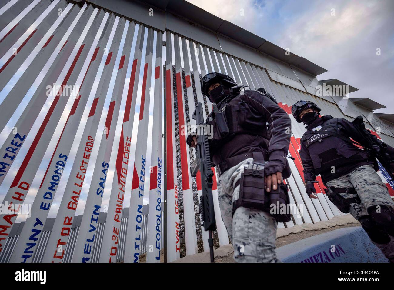 Members of the Mexican National Guard patrol next to the U.S.-Mexico ...