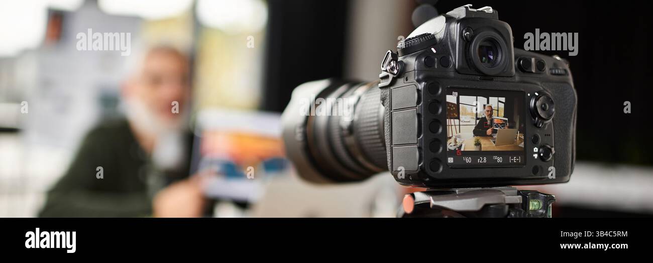 A professional camera focuses on capturing vibrant moments in a busy ...