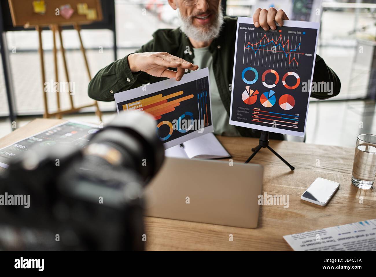A professional shares insights with charts in a sleek office during a ...