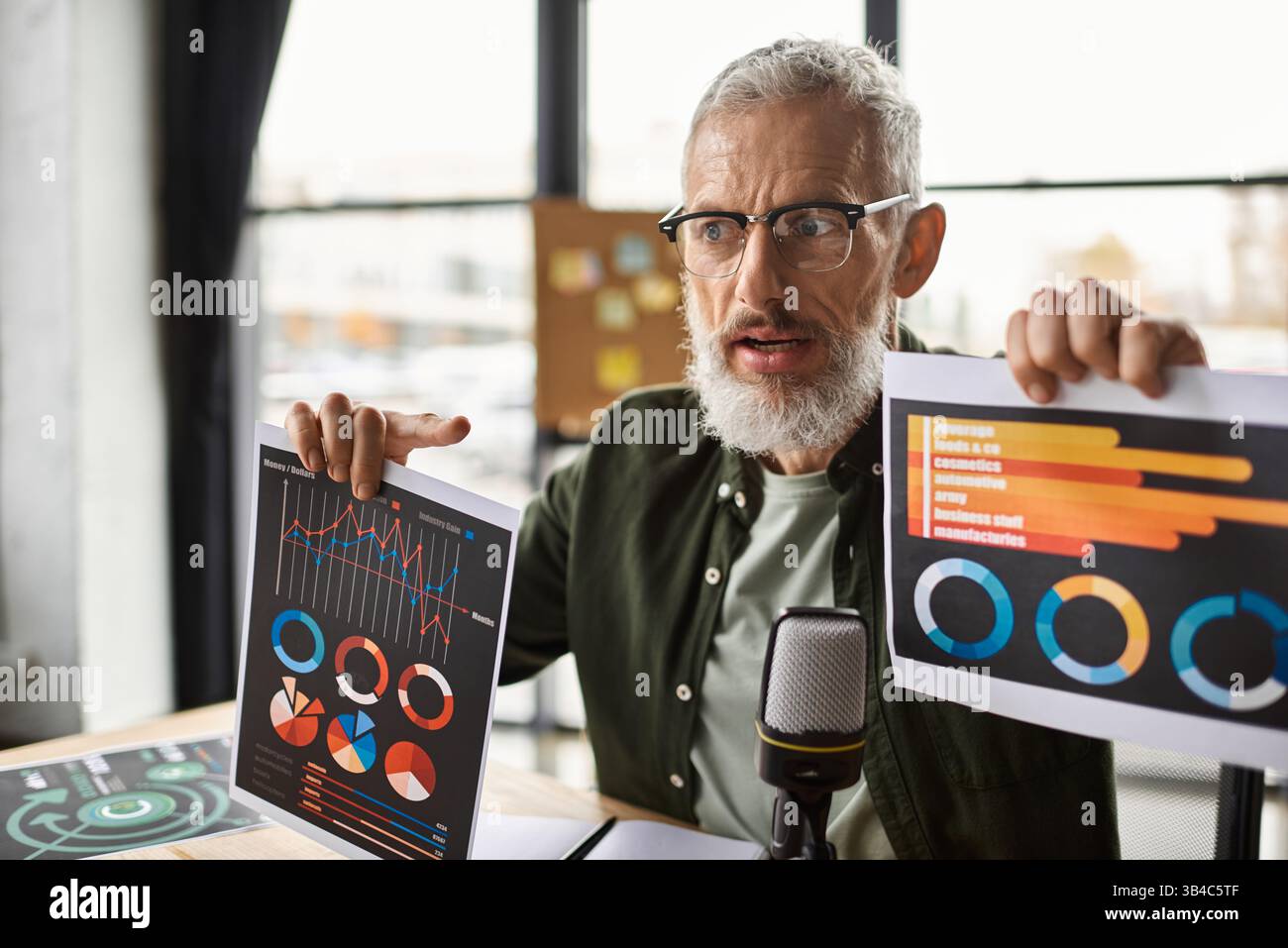 A senior man shares data trends and graphs in an online meeting in a ...