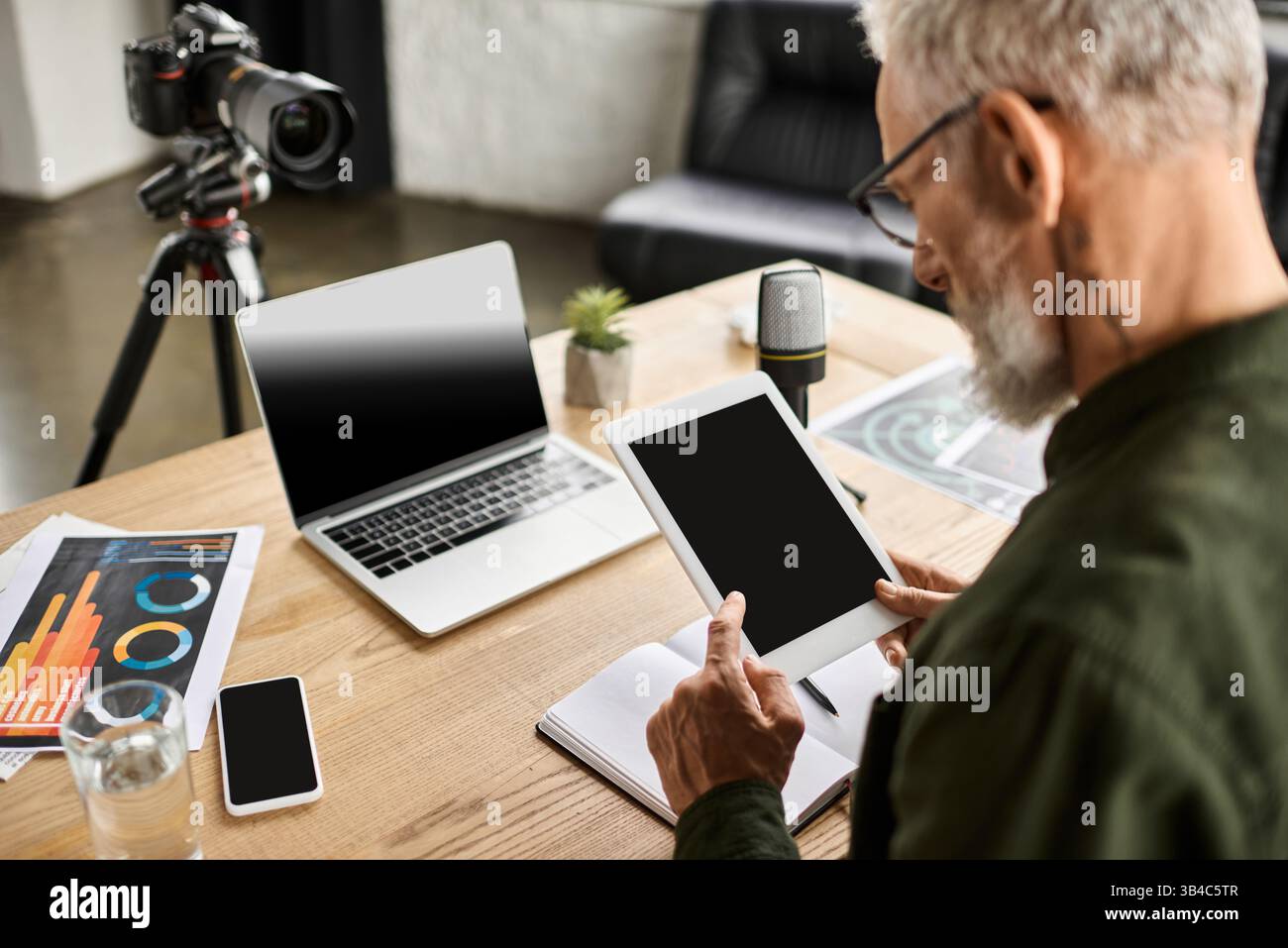 Professional focused on digital content creation while utilizing ...