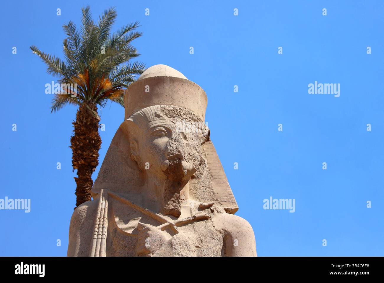 Damaged Pharaoh Statue with Crossed Arms at Karnak Temple, Luxor, Egypt ...