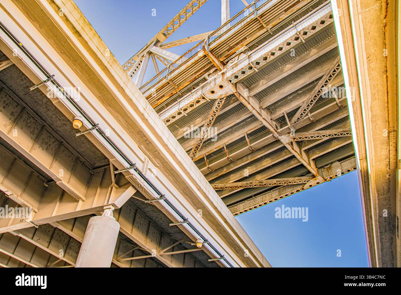 Intersection of two crossing highway bridge spans seen from below Stock ...