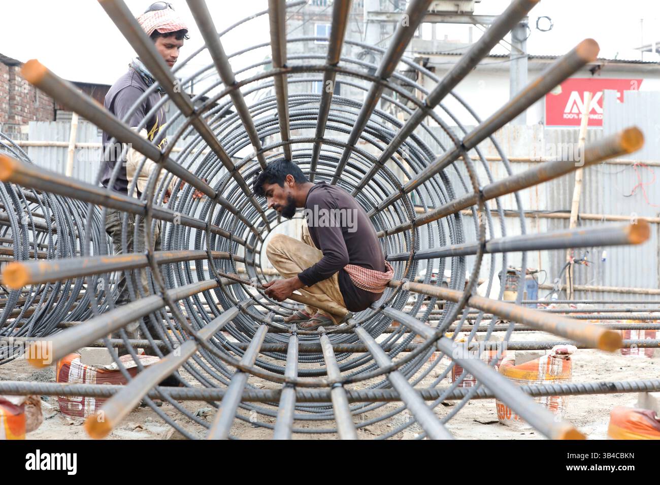 Dhaka, Bangladesh - April 30, 2025: Bangladeshi construction workers ...