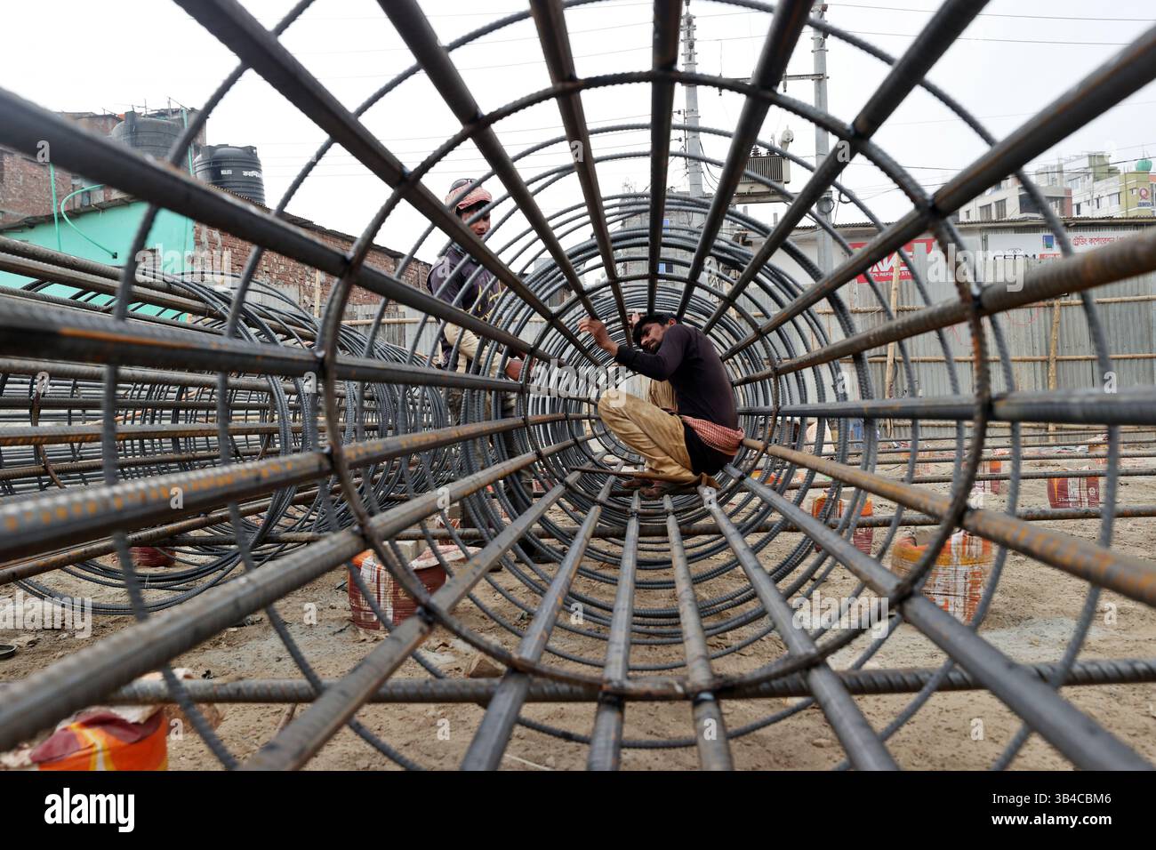 Dhaka, Bangladesh - April 30, 2025: Bangladeshi construction workers are working without any ...