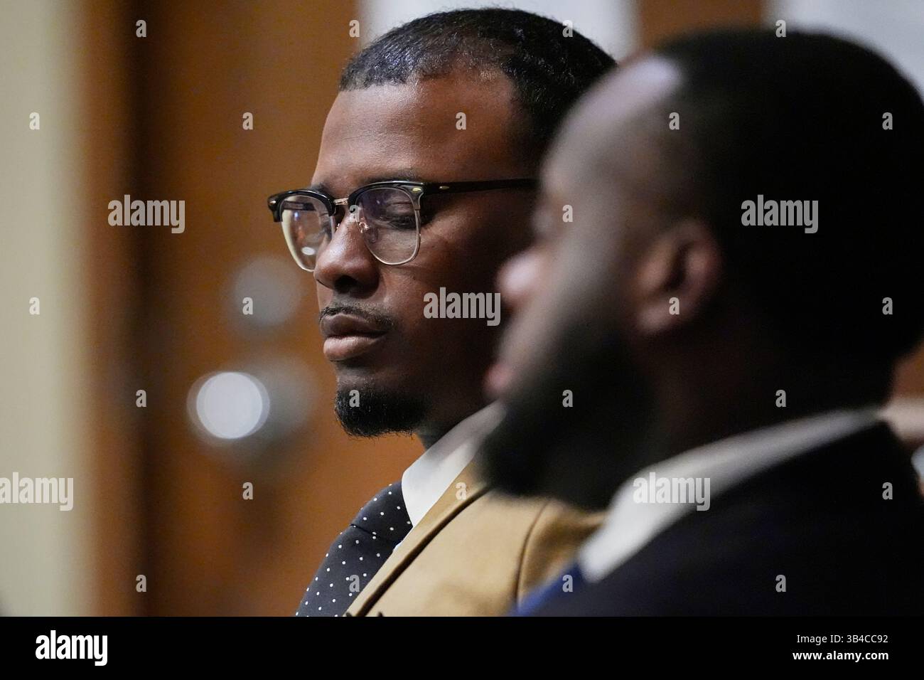 Former Memphis Police Officer Justin Smith Jr., left, sits in the ...