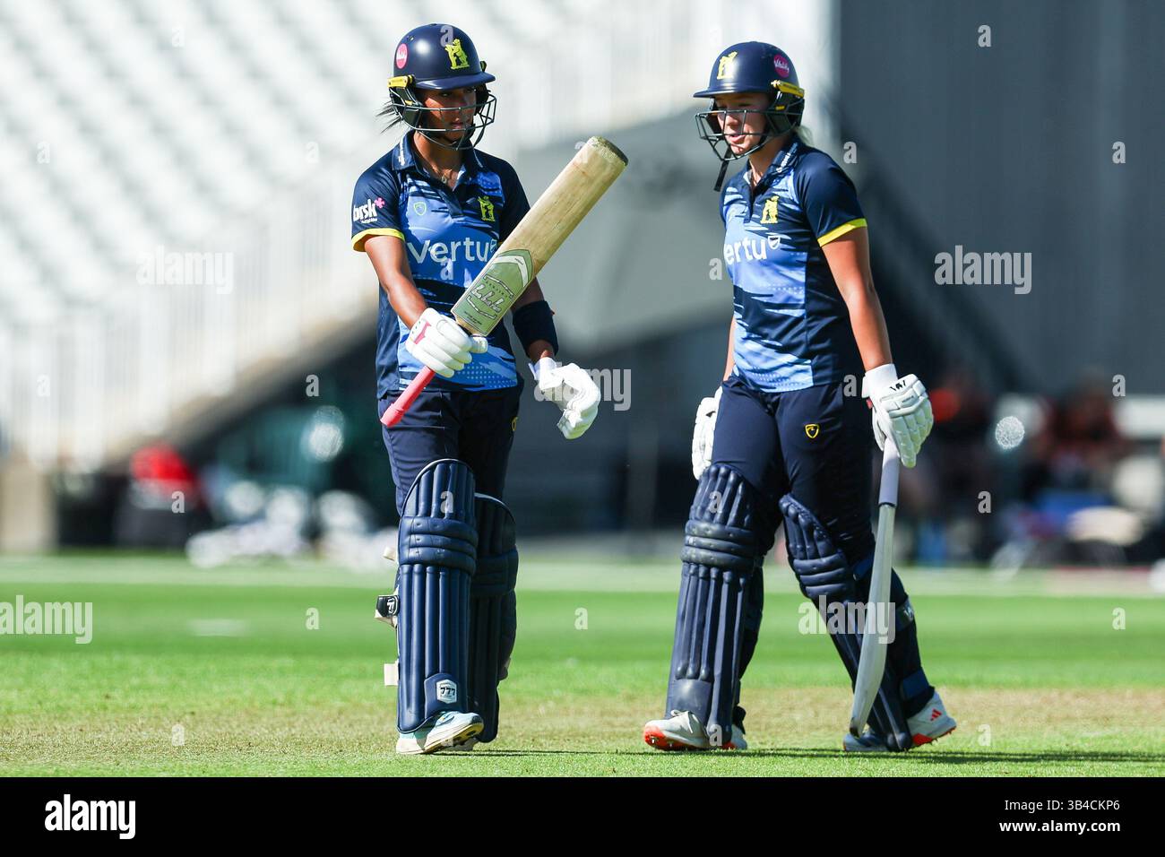 #8, Davina Perrin of Warwickshire raises her bat as she celebrates her ...