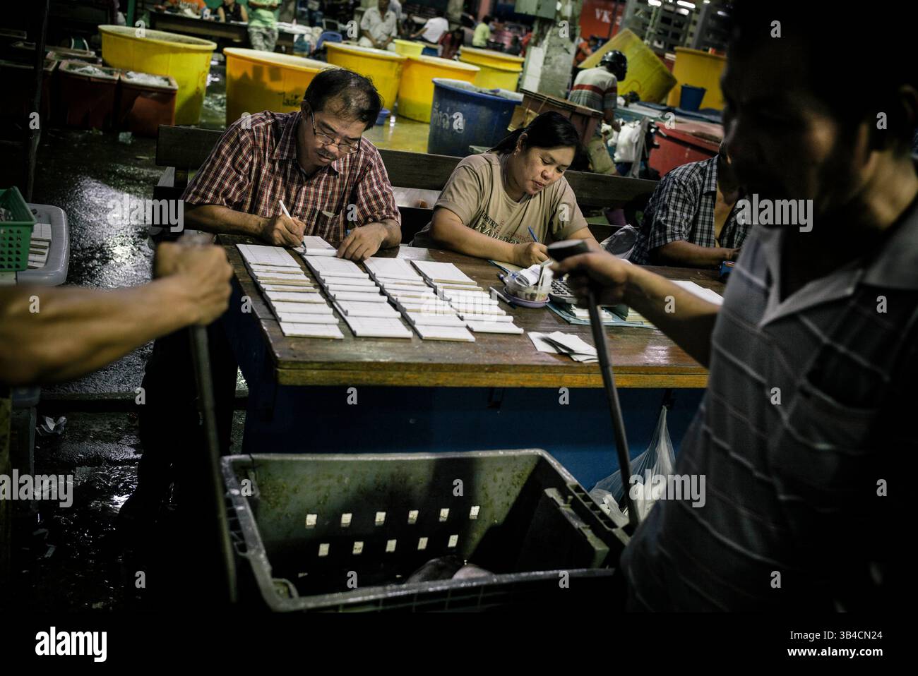 Mar 10, 2015 - Bangkok, Thailand - Workers sort fish at a wholesale ...