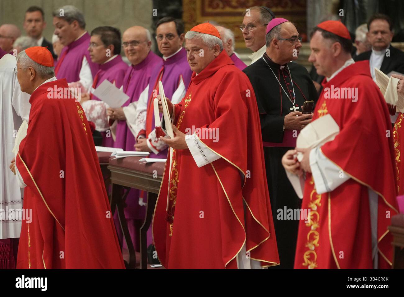 Cardinal Konrad Krajewski, centre, attends a mass on the fifth of nine ...