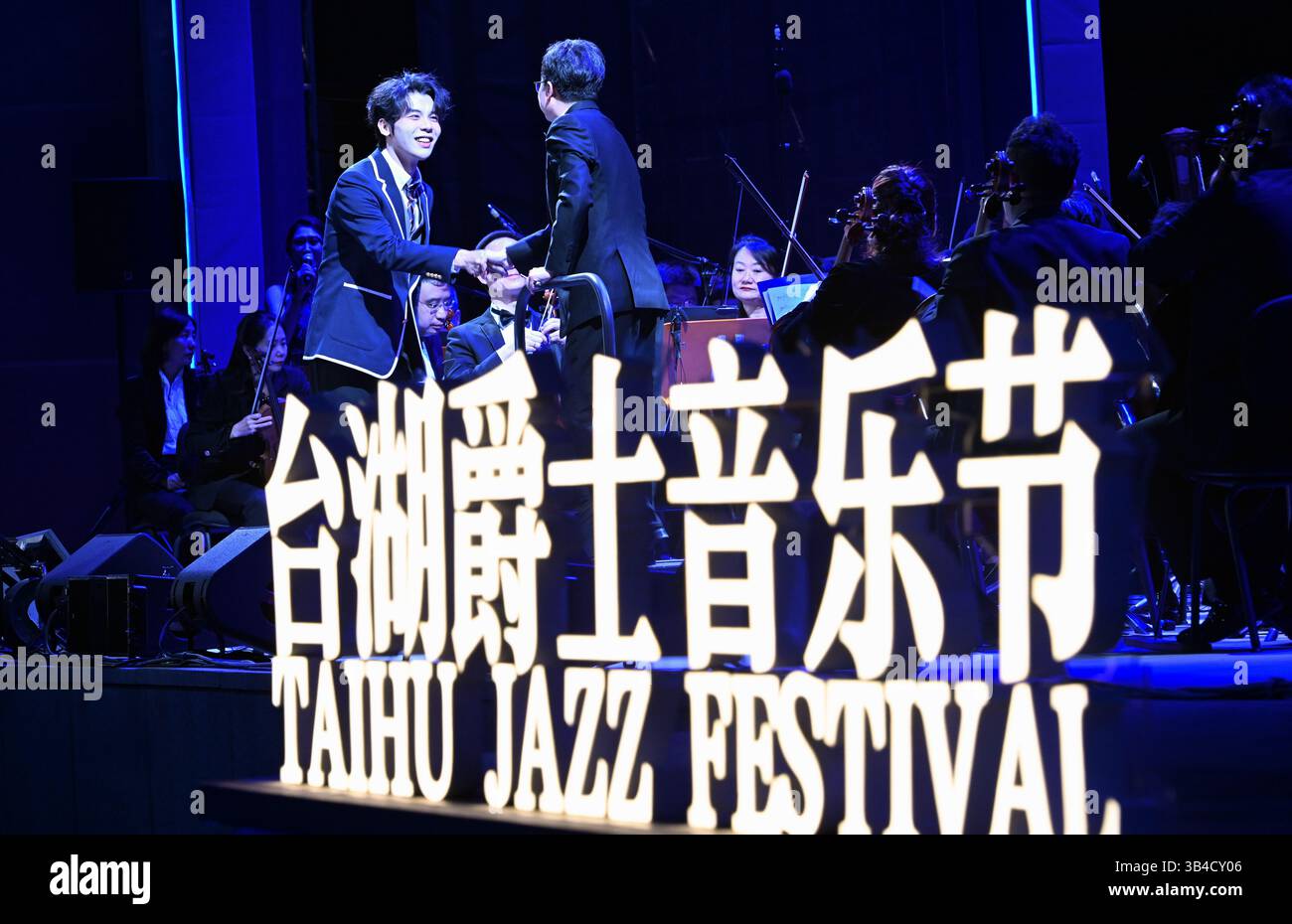 Beijing, China. 30th Apr, 2025. Singer Jia Fan (L) performs during a ...