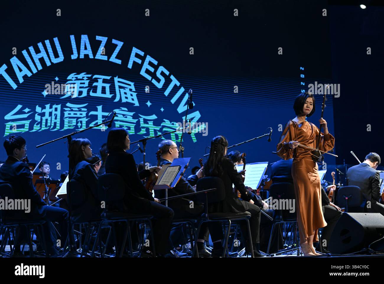 Beijing, China. 30th Apr, 2025. Musician Gao Xue plays erhu, a traditional Chinese instrument ...