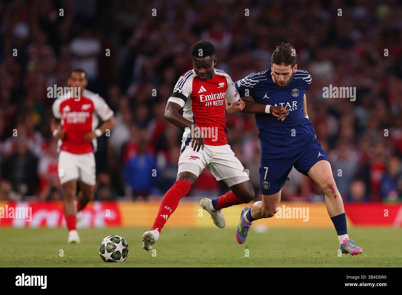 Bukayo Saka of Arsenal and Khvicha Kvaratskhelia of Paris Saint-Germain ...