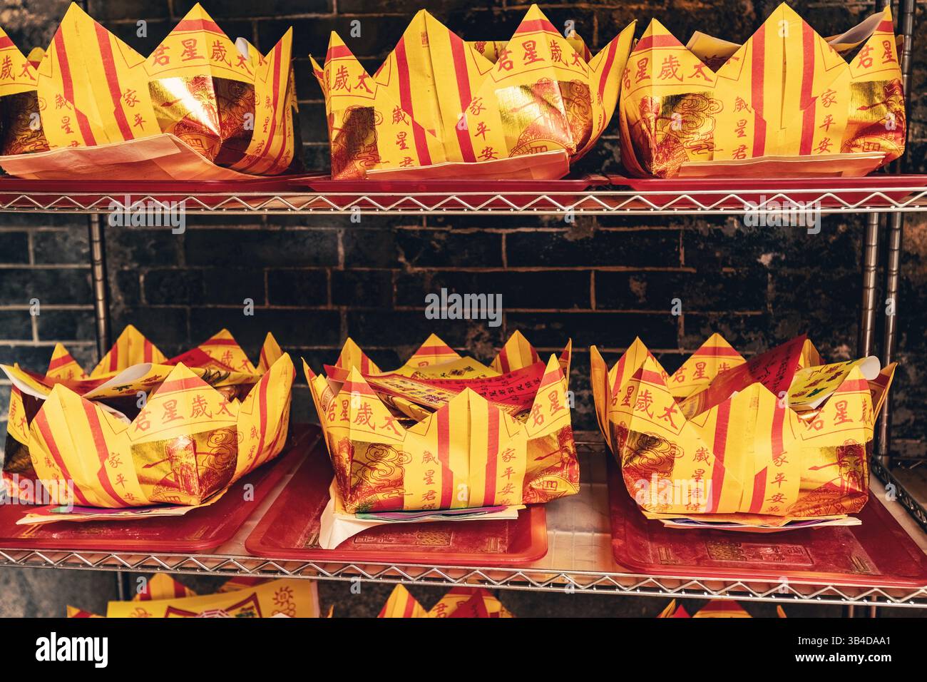 Offerings in traditional Buddhist temple in Macau Stock Photo - Alamy