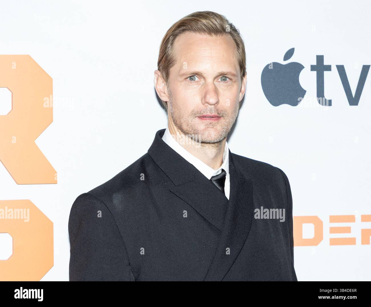 Alexander Skarsgard wearing dress by Calvin Klein attends Apple TV+ ...