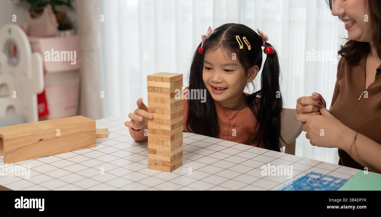 Back to School Fun and Learning. A young girl and her mother play a ...