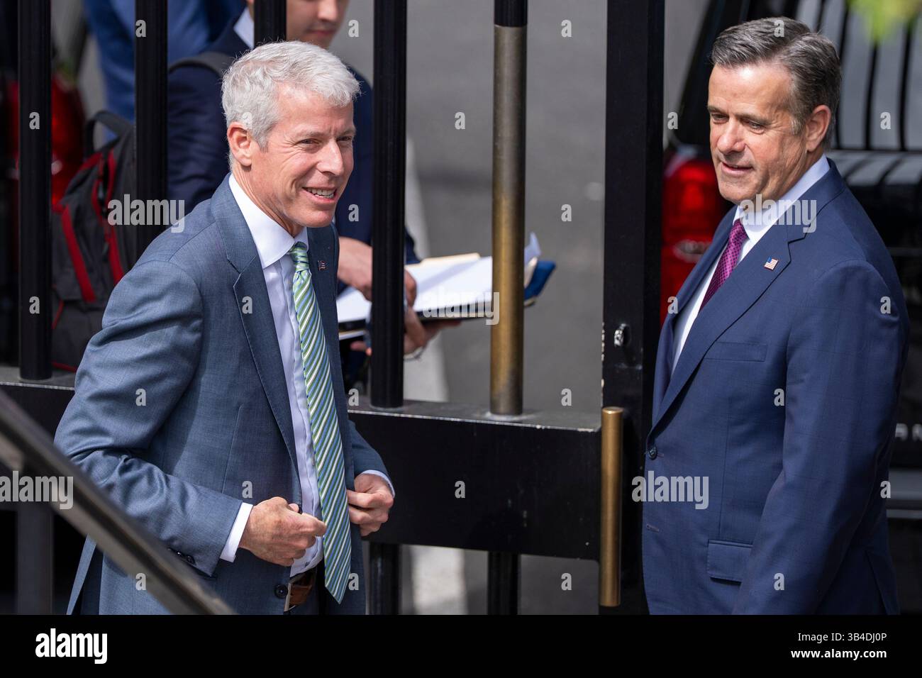 Energy Secretary Chris Wright, left, talks with CIA Director John ...