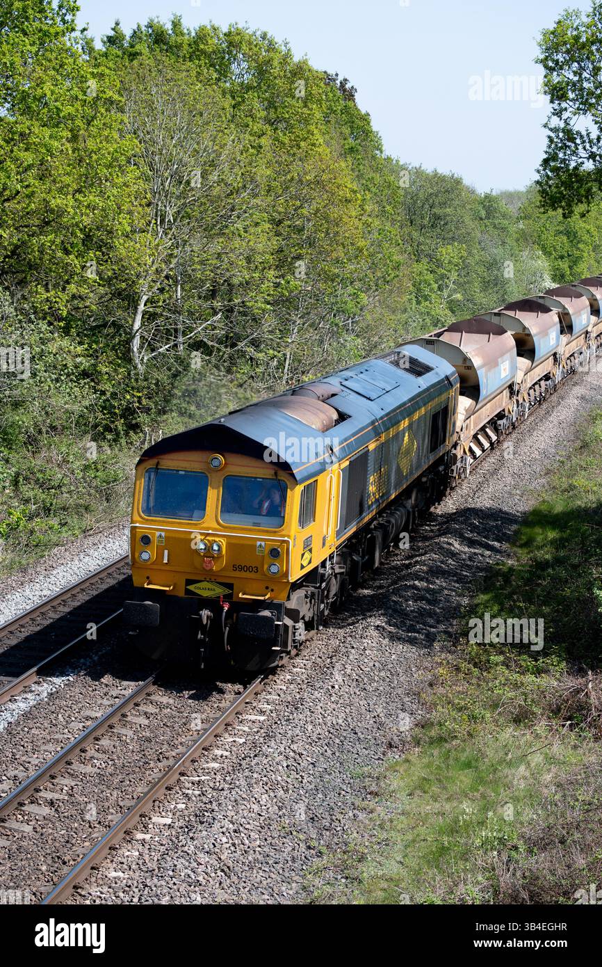 Colas Rail class 59 diesel locomotive No. 59003 pulling empty Network Rail wagons at Hatton Bank ...