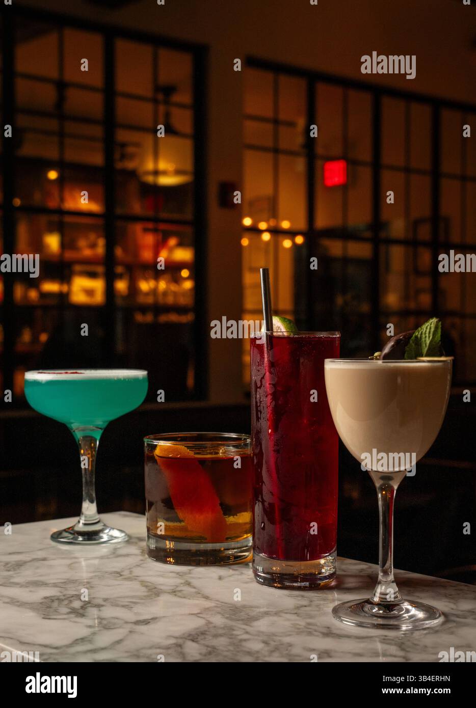 Four Signature Cocktails on Marble Bar Stock Photo - Alamy