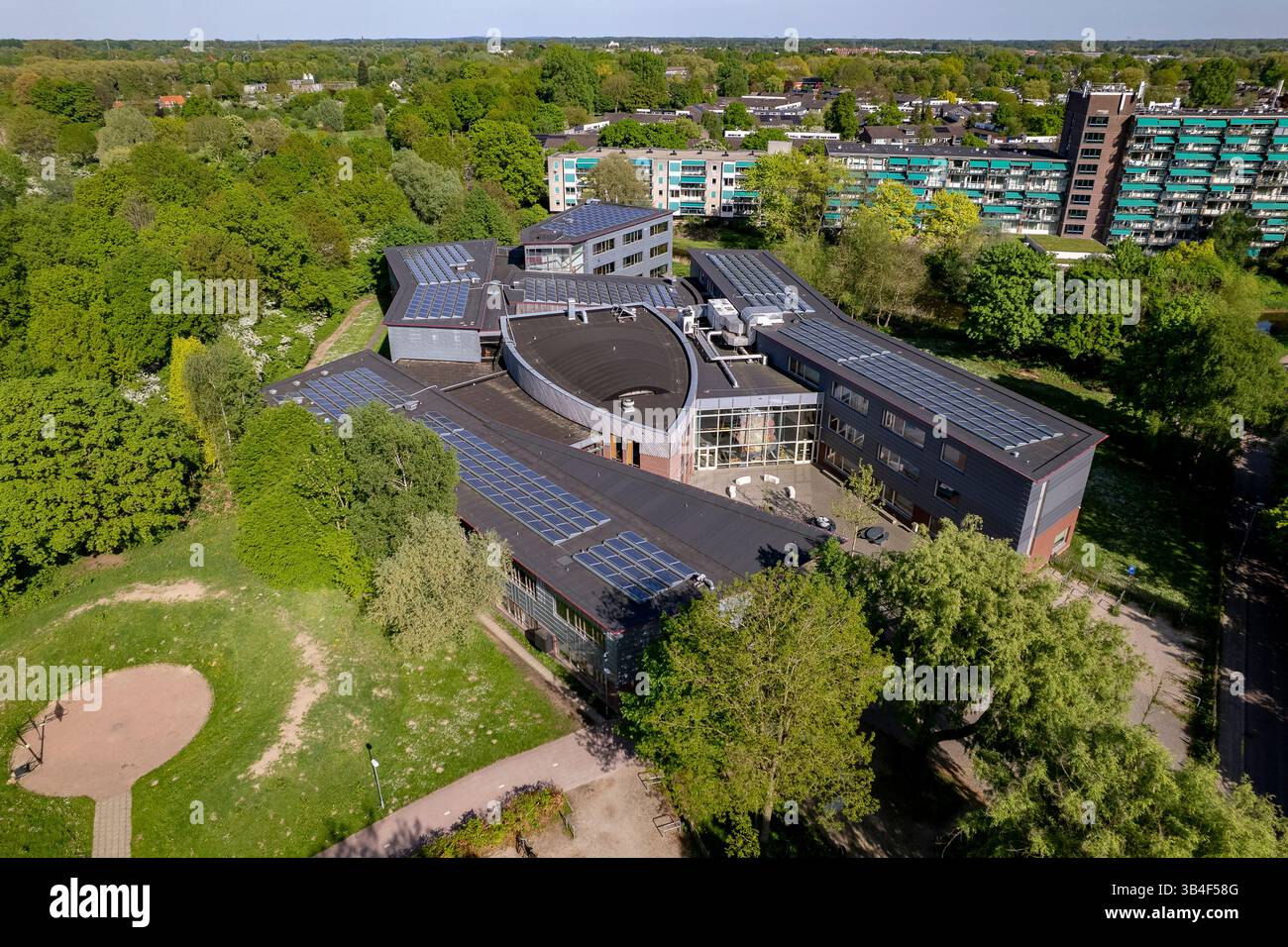 Residential neighbourhood with high school building seen from above ...