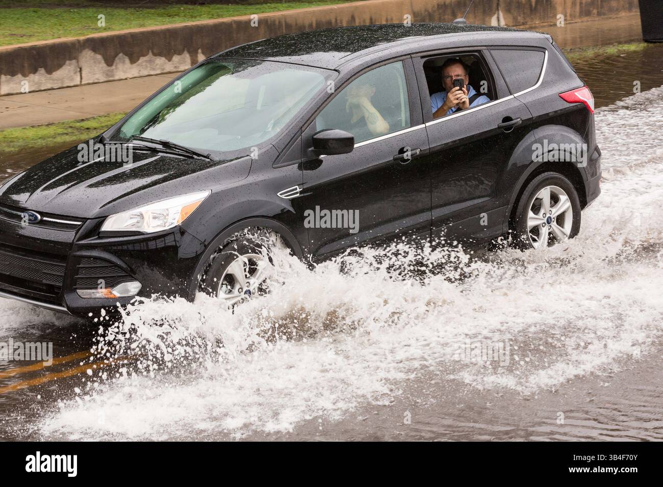 Car passes through downtown hi-res stock photography and images - Alamy
