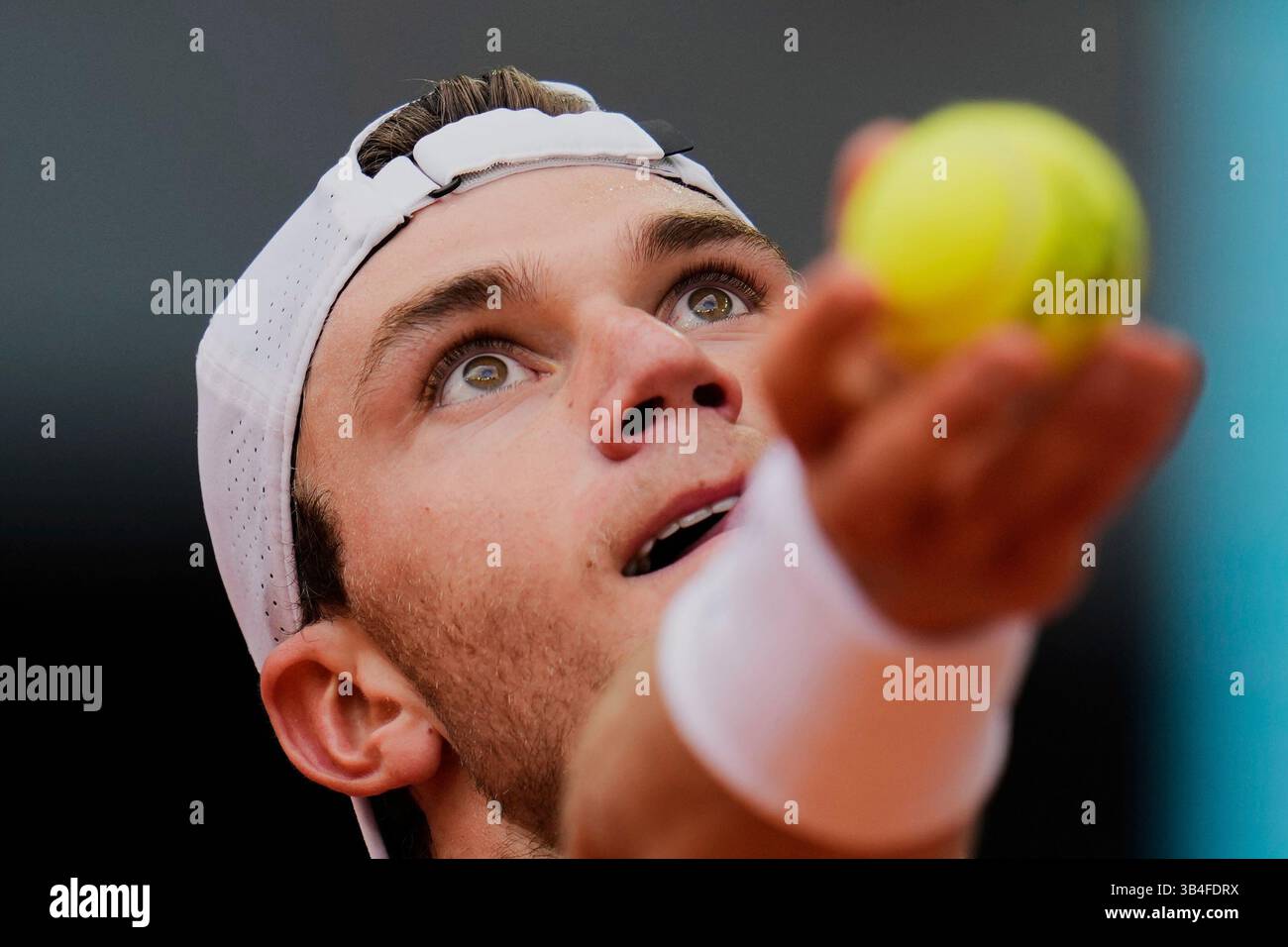 Jack Draper of Great Britain serves against United States' Tommy Paul ...