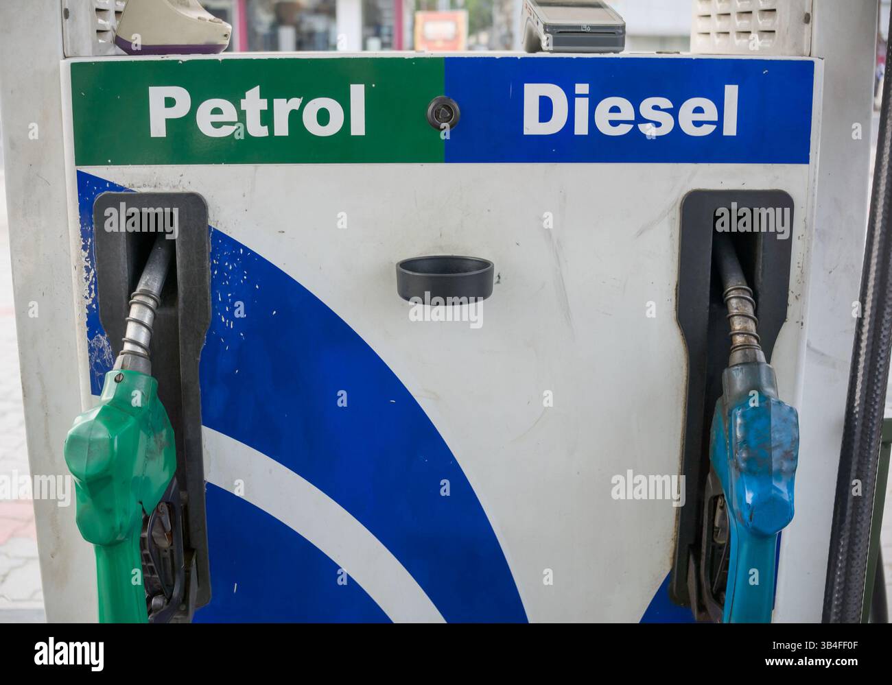 Two fuel dispensers at a service station showing petrol and diesel ...
