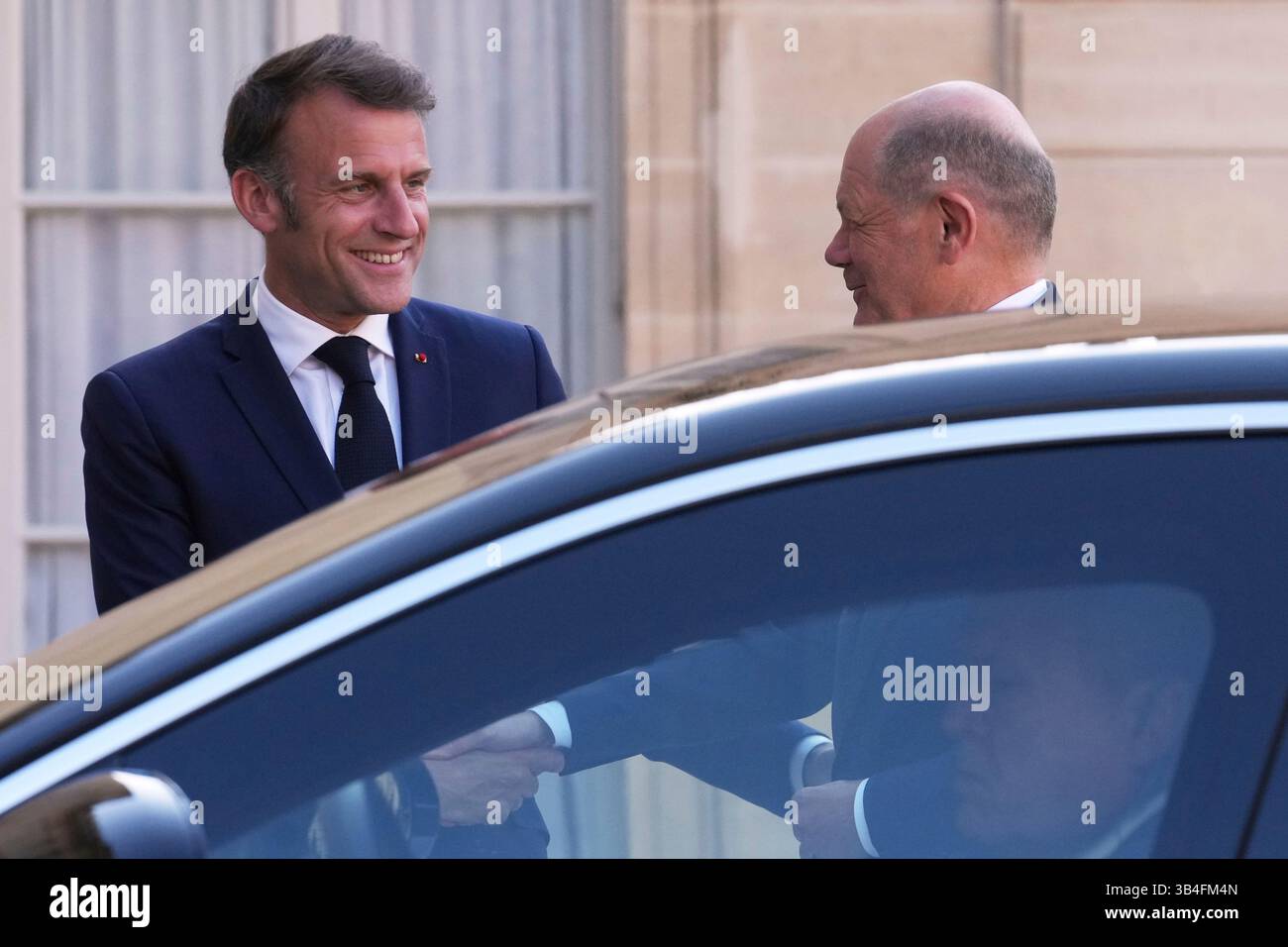 French President Emmanuel Macron, left, welcomes German Chancellor Olaf ...