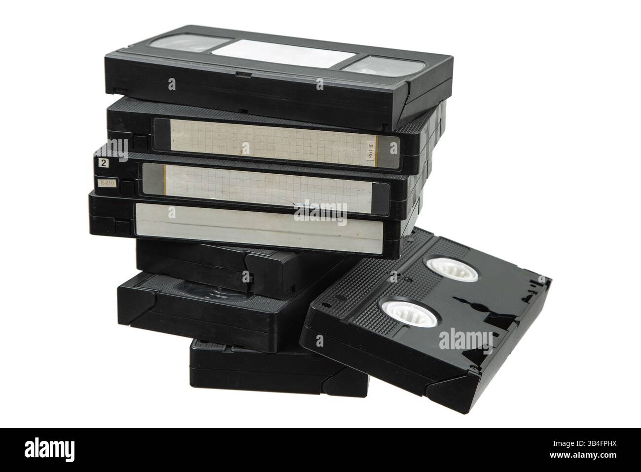 Stack of vintage VHS video tapes in black plastic cases, some labeled ...