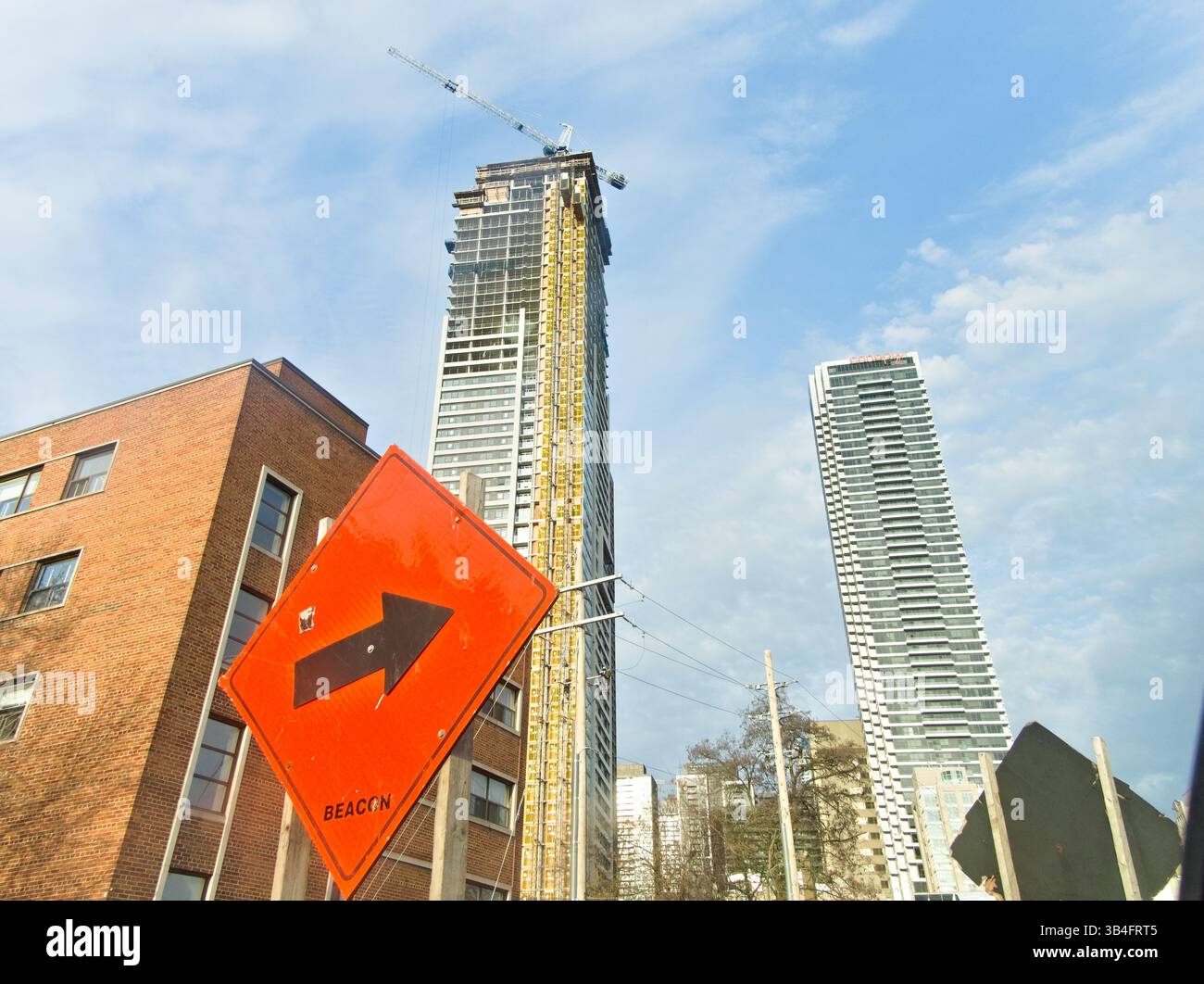 A striking view of downtown Toronto featuring a skyscraper under ...