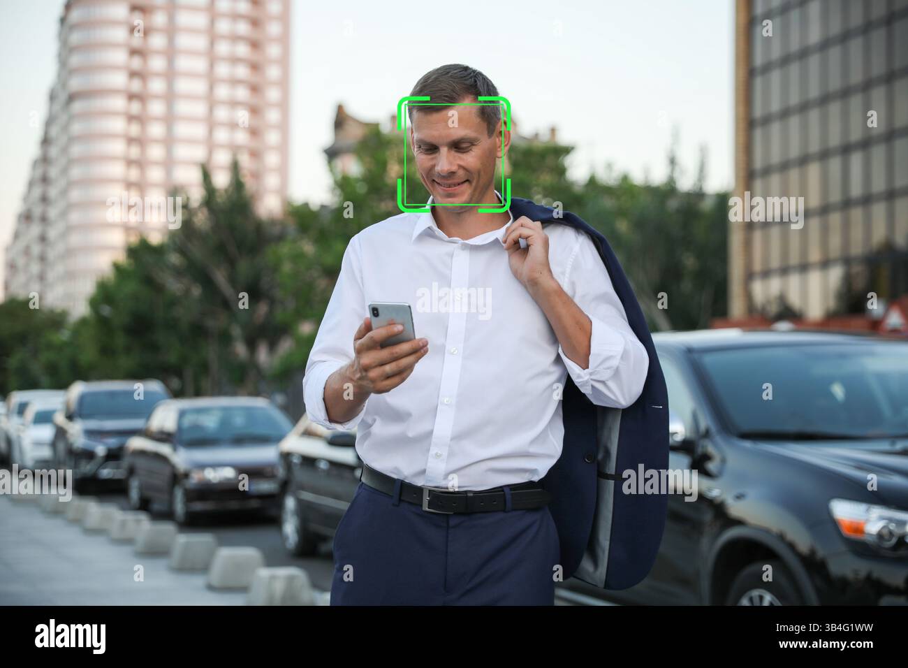 Facial recognition system identifying smiling man using smartphone on ...