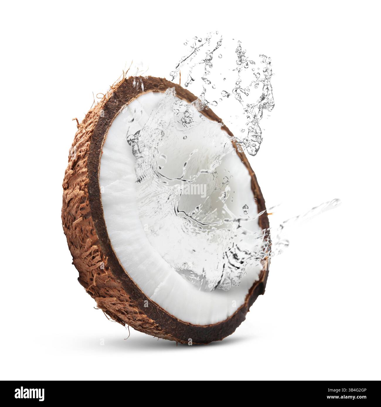 Coconut water splashing out of nut on white background Stock Photo - Alamy