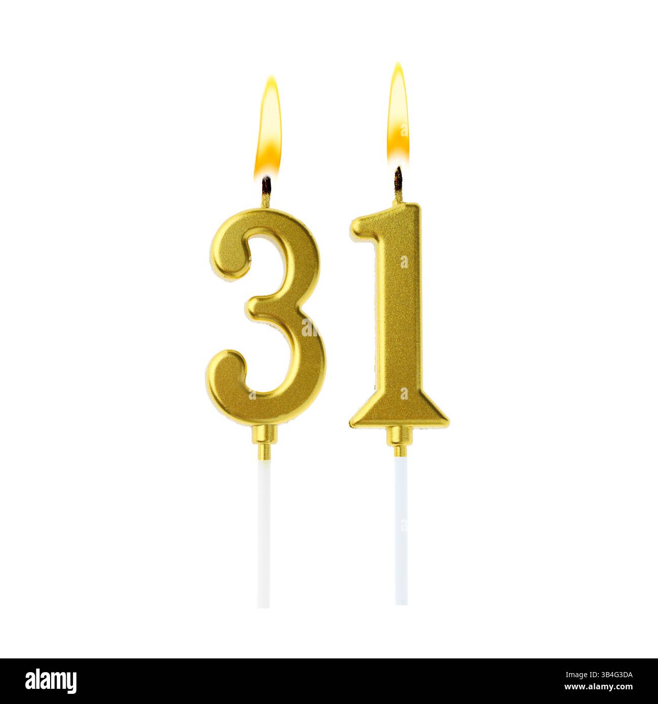 Burning golden cake candles composing number 31 on white background ...
