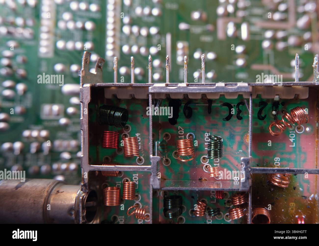 Electronic air-core inductors on printed circuit board. Colored spiral ...