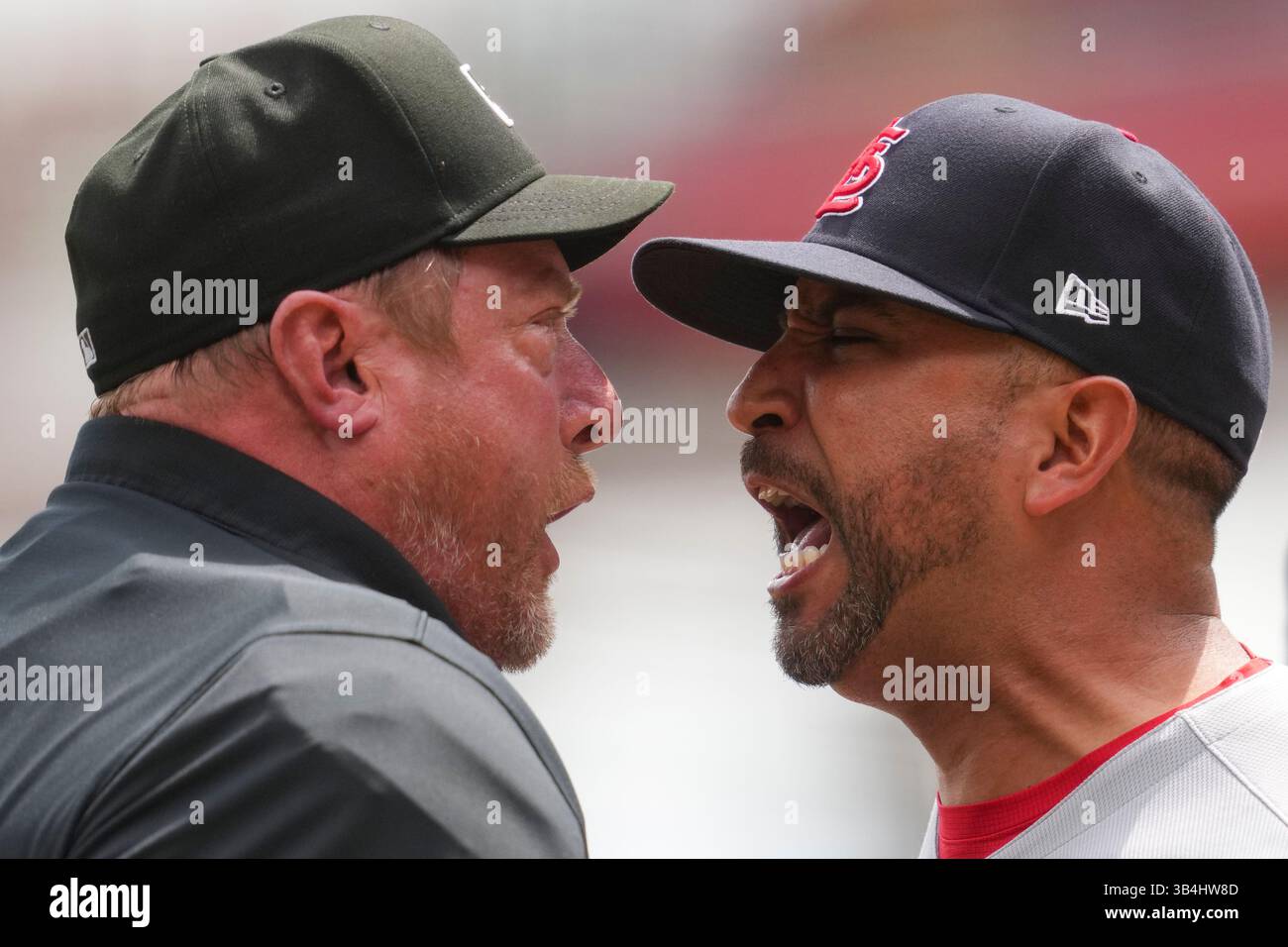 St. Louis Cardinals manager Oliver Marmol, right, reacts after being ...
