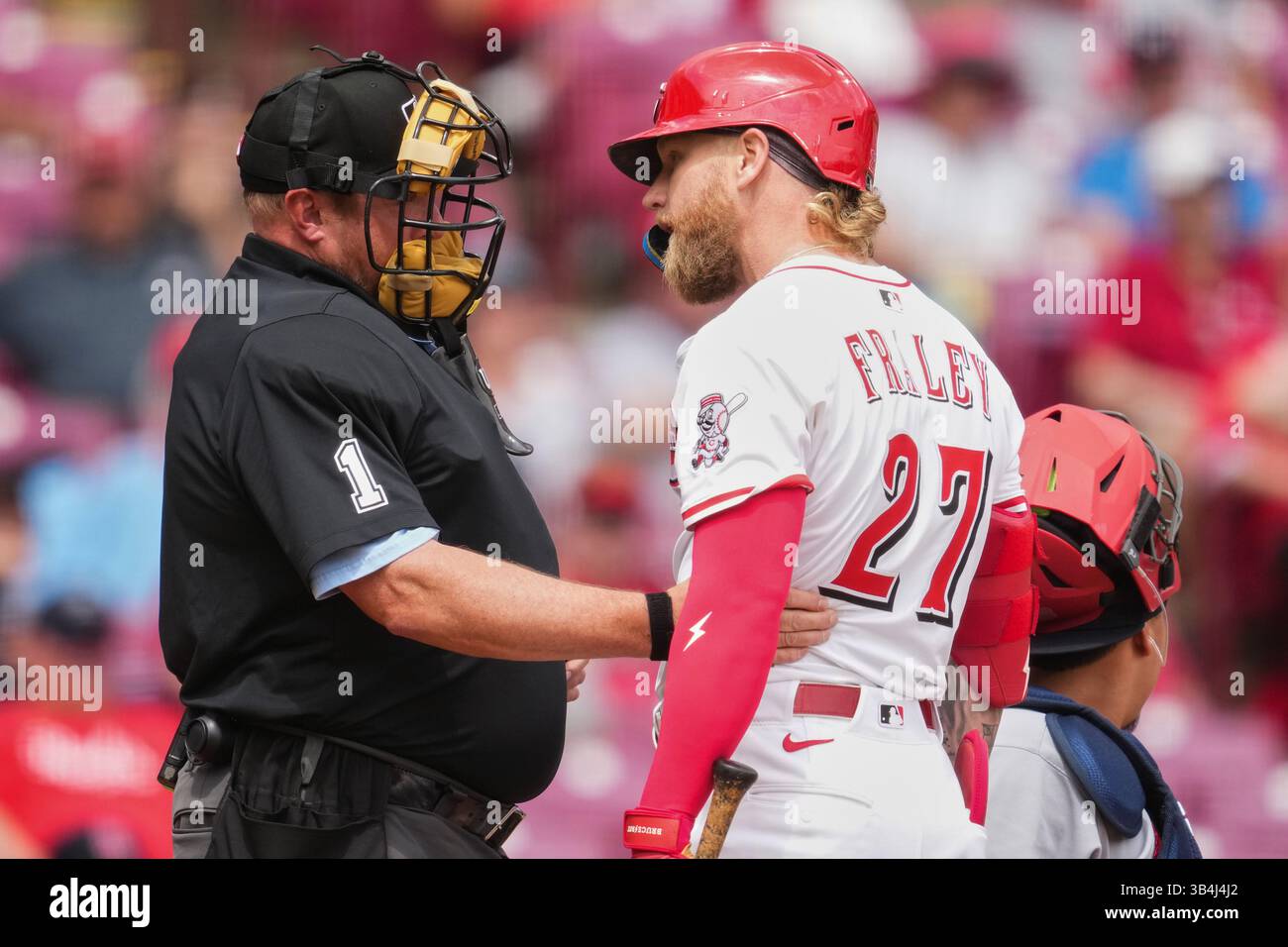 Cincinnati Reds' Jake Fraley (27) reacts to a called strike by umpire ...