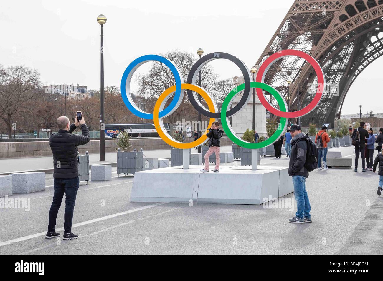 People posing with Olympic Rings and Eiffel Tower in Paris, France ...