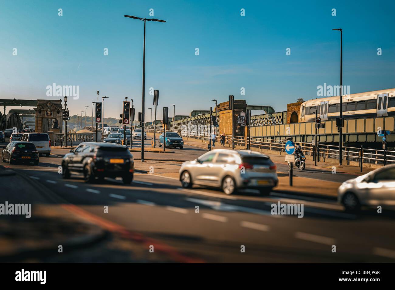 Southeastern train traveling towards London and traffic crossing the ...