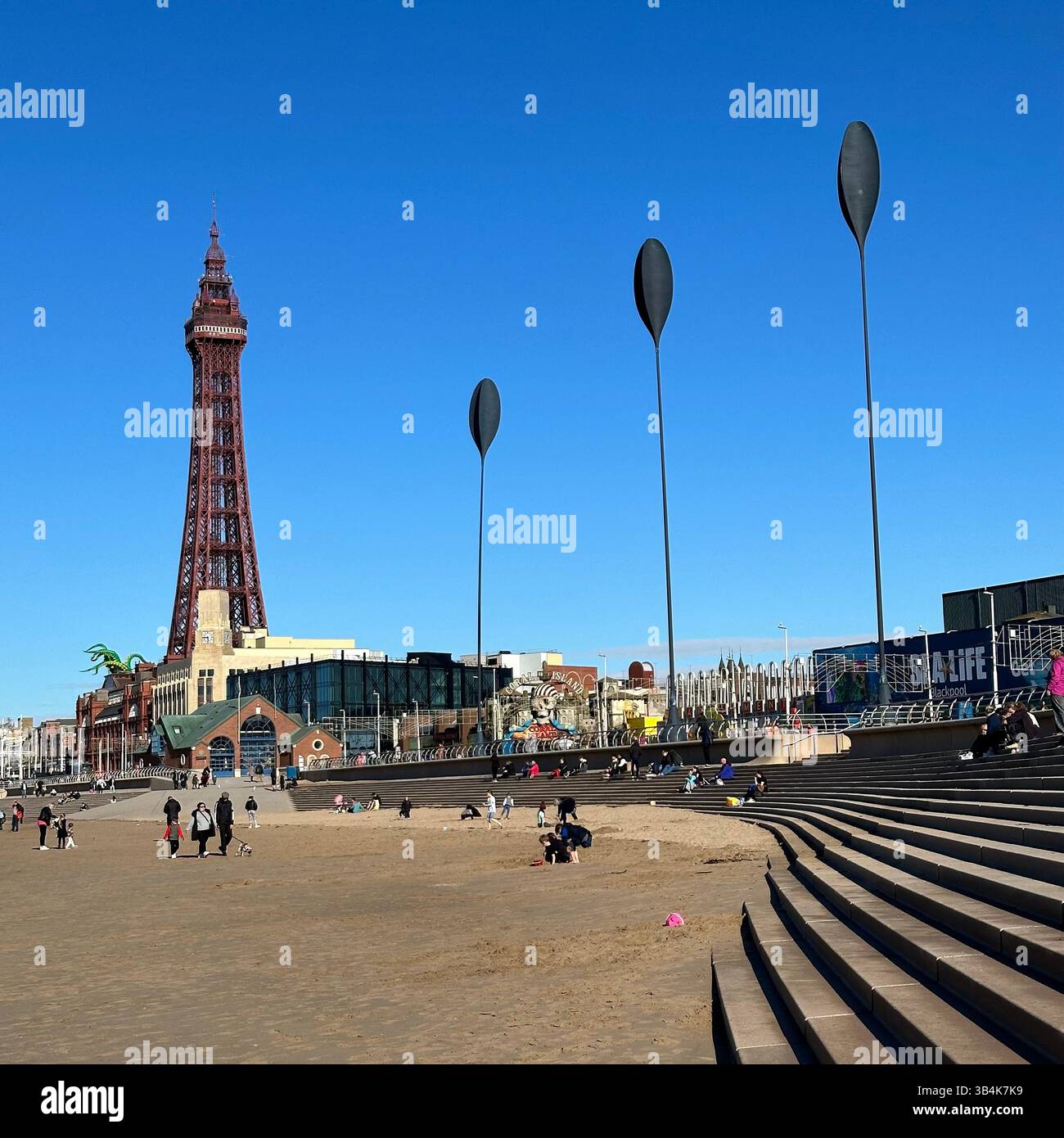 View of Blackpool Tower from the promenade on a clear sunny day with ...