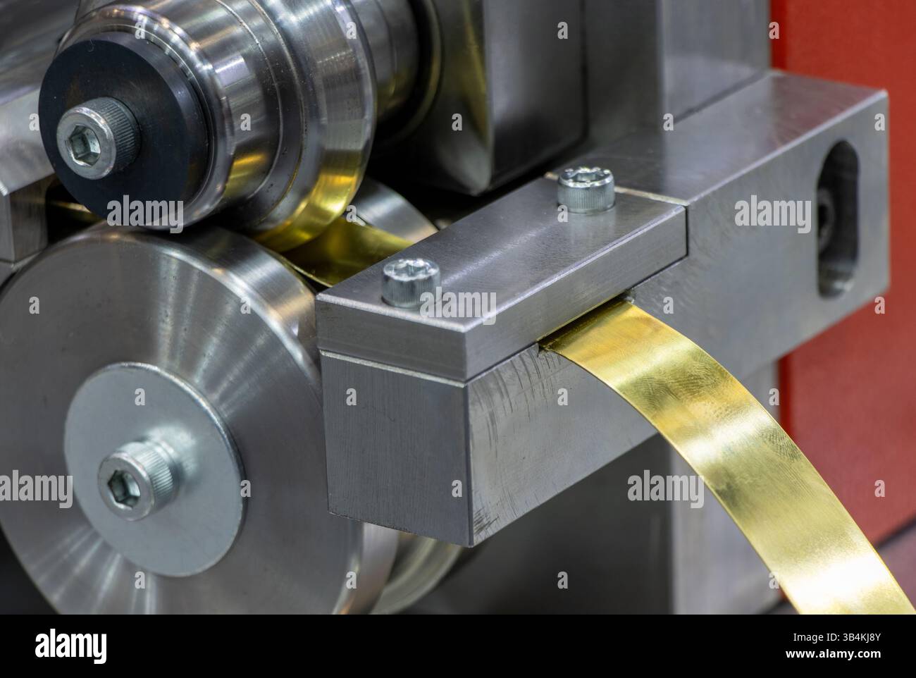 Gold rolling crimping press machine Stock Photo - Alamy