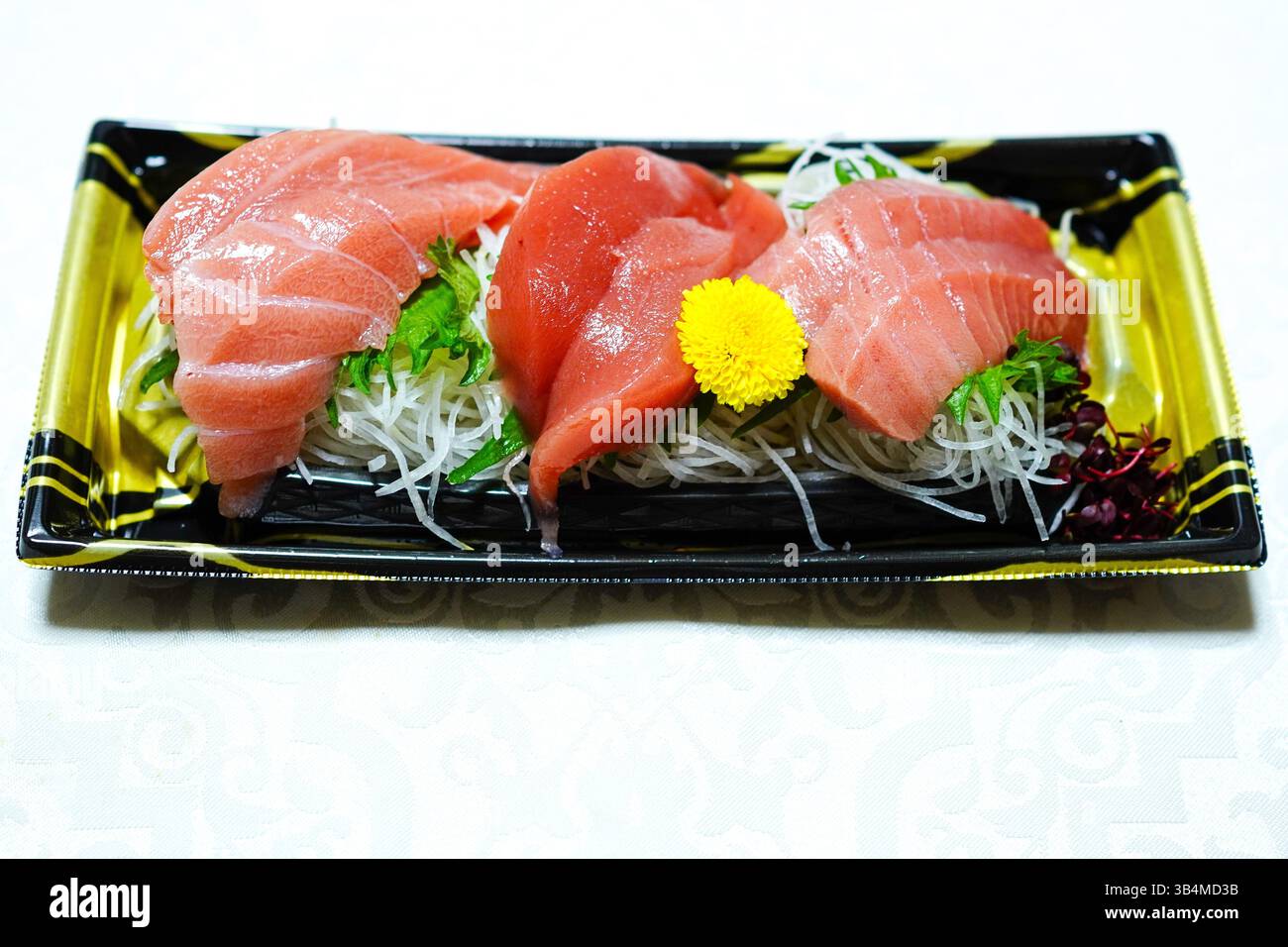 Assorted tuna sashimi in sushi containers for take-out Stock Photo - Alamy