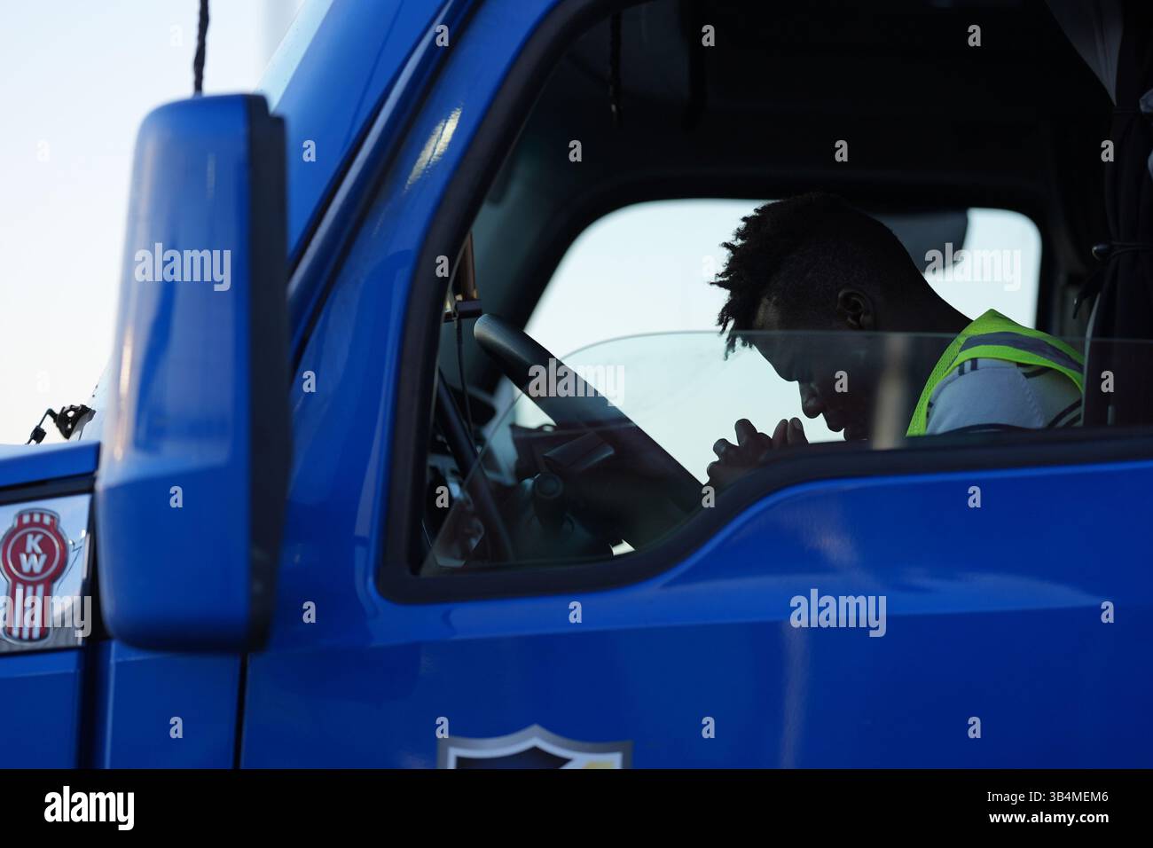 Haitian immigrant Kevenson Jean, a truck driver, prays before beginning ...