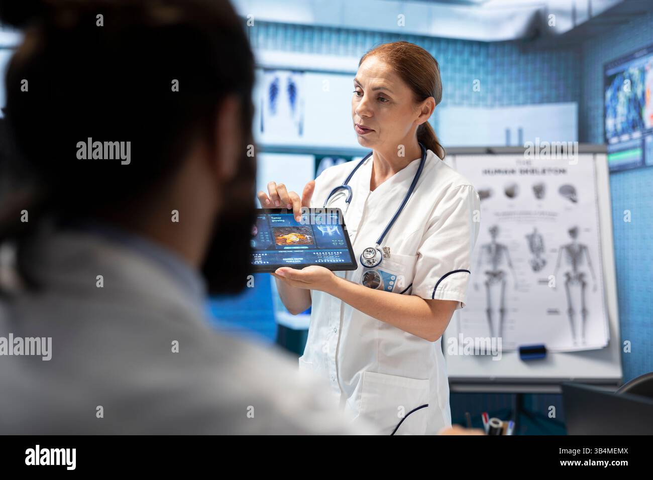 Doctor neurologist showing mri brain scan results to her colleagues ...
