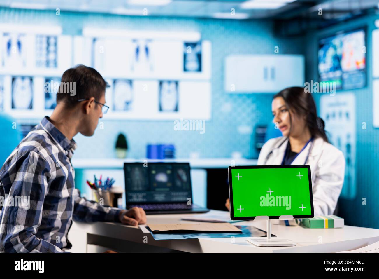 Specialist discussing x ray imaging with a patient next to isolated ...