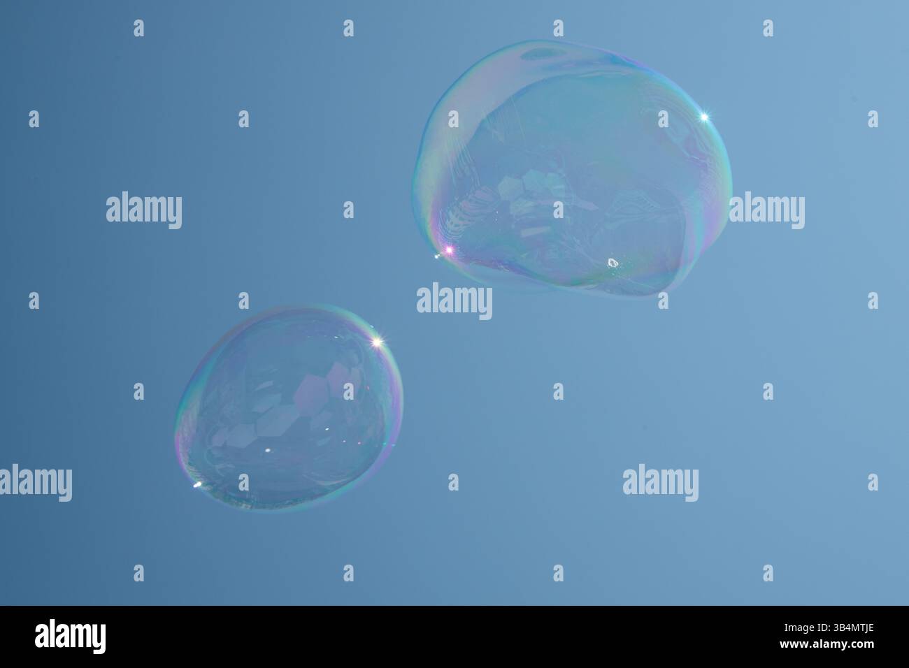 Giant Soap Bubbles Floating Against a Clear Blue Sky Stock Photo - Alamy