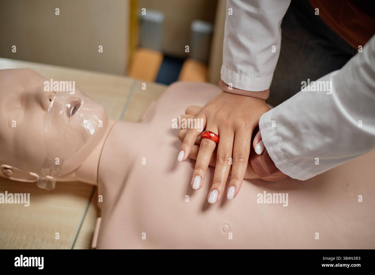 Black Student Practicing Chest Compressions on CPR Dummy Stock Photo ...