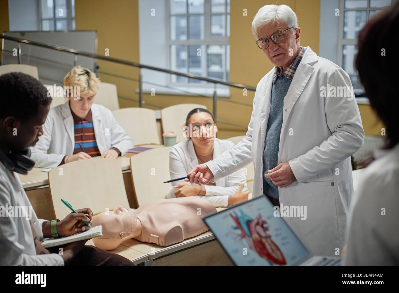 Professor Explaining CPR to Group of Students Stock Photo - Alamy
