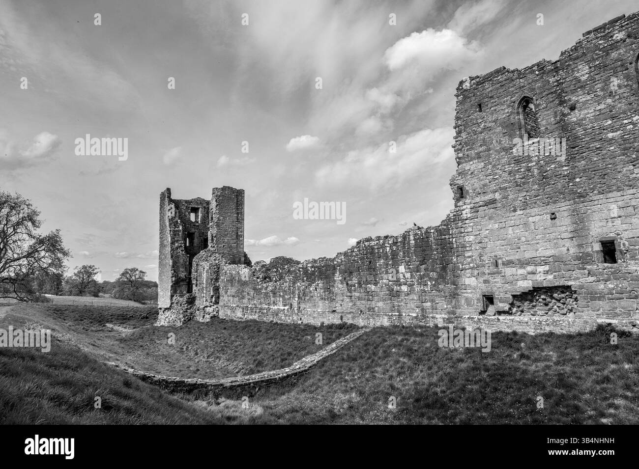 The image is of the ruins of the external walls, tower and moat at 13th ...