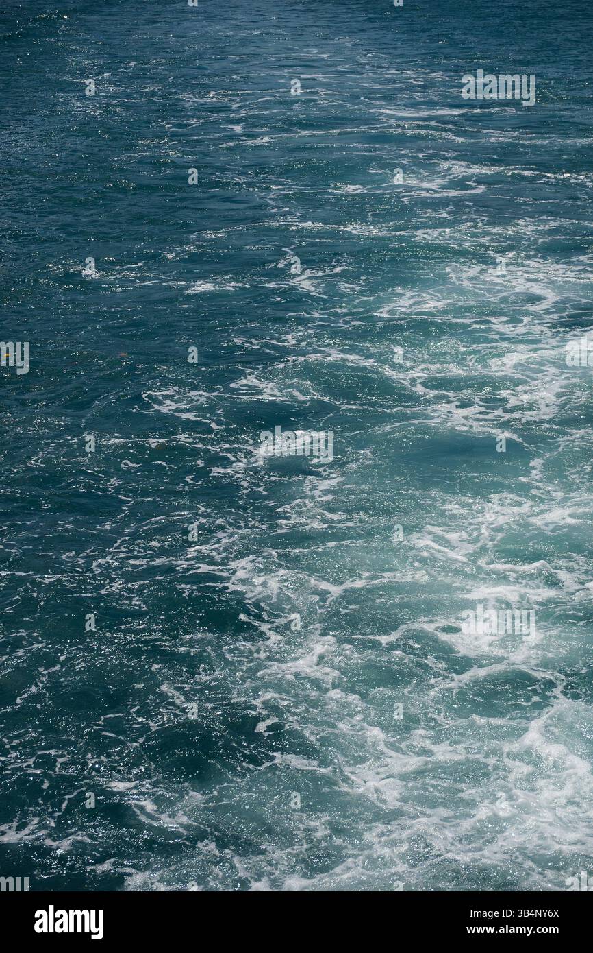 Wake of boat at sea Stock Photo - Alamy