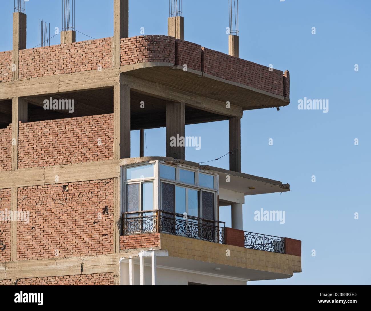 An unfinished building in Esna, Egypt, with brick and concrete ...
