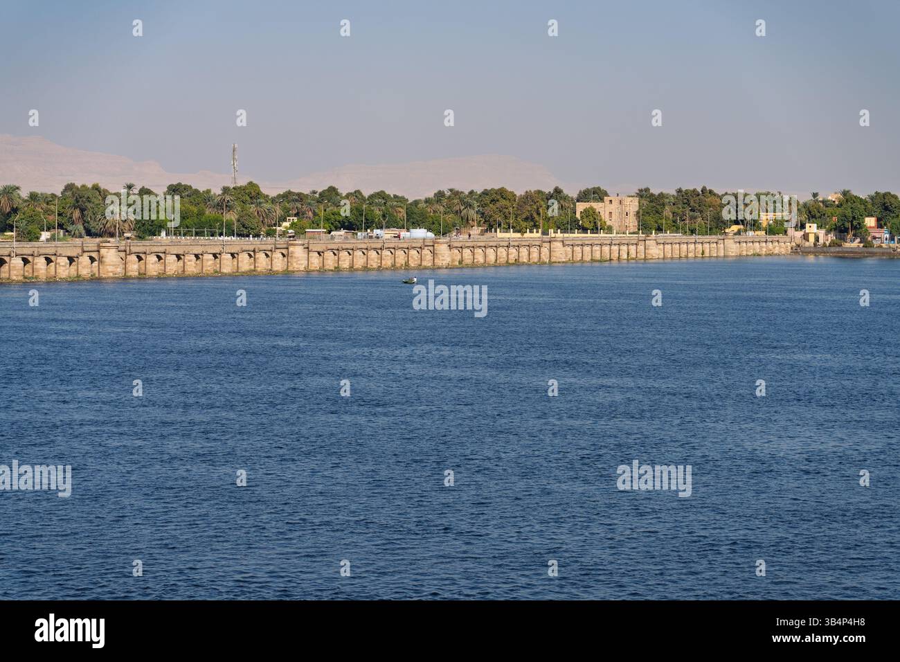 Old Esna dam and lock across the Nile River with sandy hills of Sahara ...